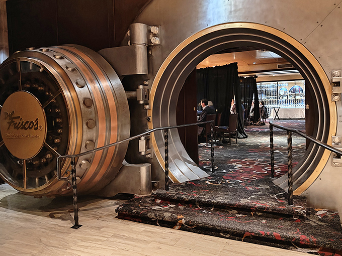 The original bank vault door now welcomes diners instead of protecting deposits. Your assets are still safe—they've just moved from your wallet to your stomach.