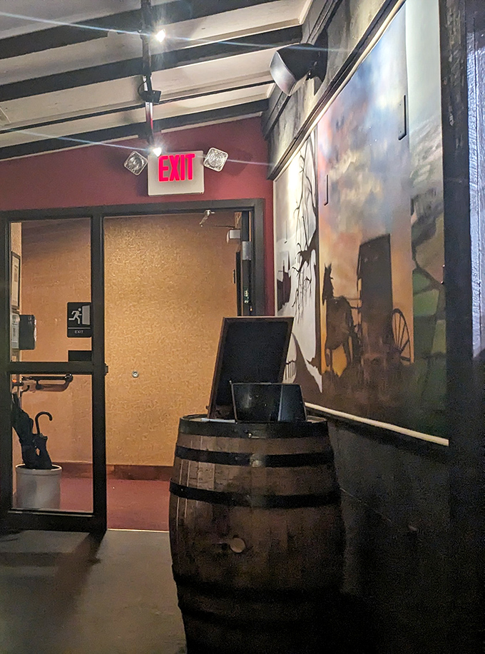 Even the exit has character &ndash; a barrel host stand and equestrian artwork remind you this isn't just dinner, it's a fully themed experience.