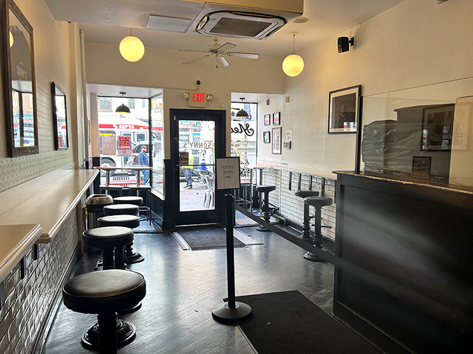 Clean lines, subway tile, and counter seating&mdash;the perfect vantage point for watching the choreographed chaos of cheesesteak creation.