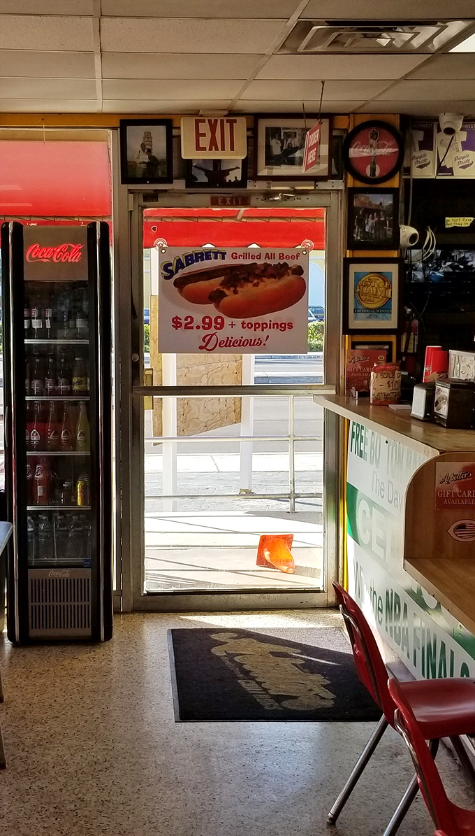 The exit sign might point to the door, but the Sabrett hot dog poster reminds you why you'll be coming back again soon.