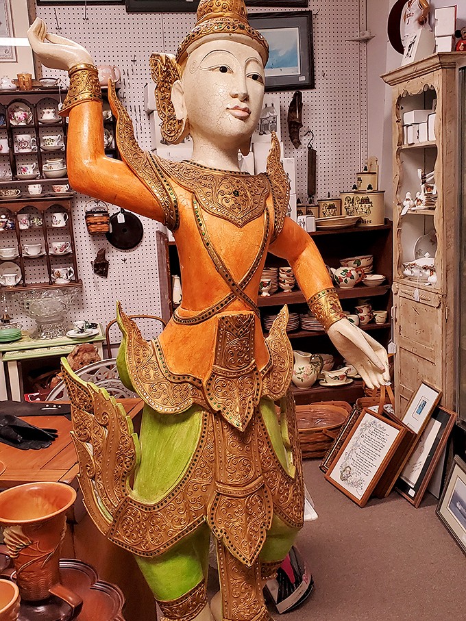 This Thai temple guardian statue has traveled farther to reach this mall than most of us will go on our summer vacations.
