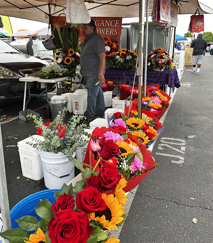 A riot of roses and sunflowers creates an impromptu garden in the asphalt jungle. Nature's perfume department is open for business!