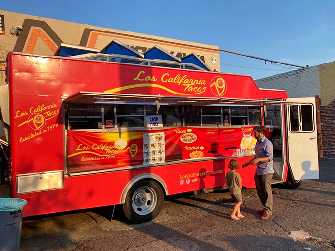 Even in the California twilight, that red truck glows with promise—a beacon for those seeking authentic flavors without pretense.