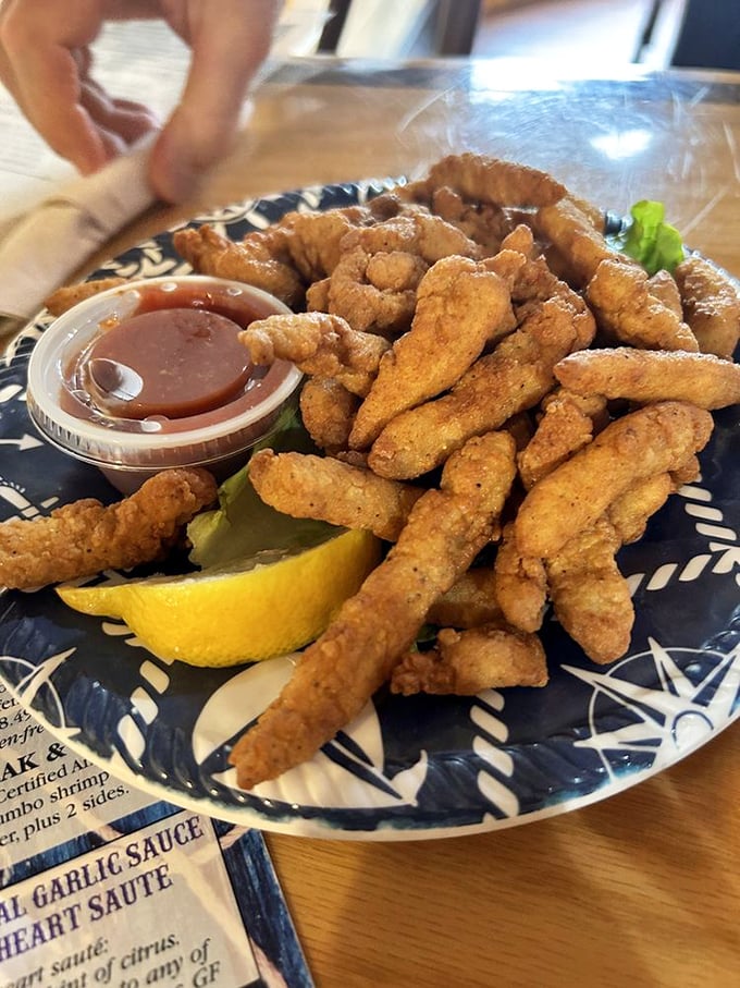 Fried clam strips that crunch like autumn leaves but taste like summer vacation. The perfect finger food for pretending you're at a New England clambake.