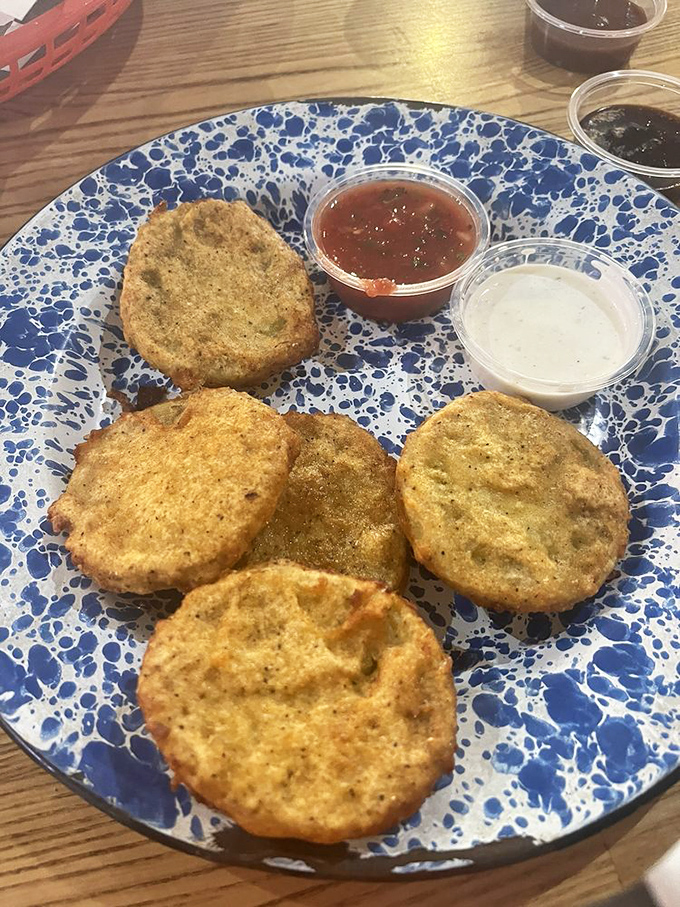 Fried green tomatoes that could convert a vegetable skeptic. Crispy, tangy, and served with dipping sauces that make you wonder why you'd eat tomatoes any other way.