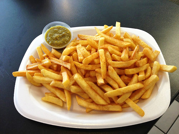 French fries so perfectly golden, they deserve their own trophy case. That dipping sauce is just showing off.
