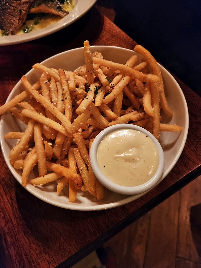 Truffle fries so perfectly golden and crisp they deserve their own security detail.