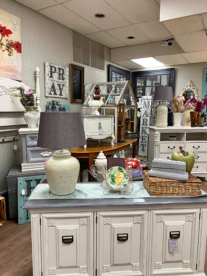 Shabby chic meets farmhouse elegance in this furniture display. That distressed cabinet has stories to tell about its previous lives.