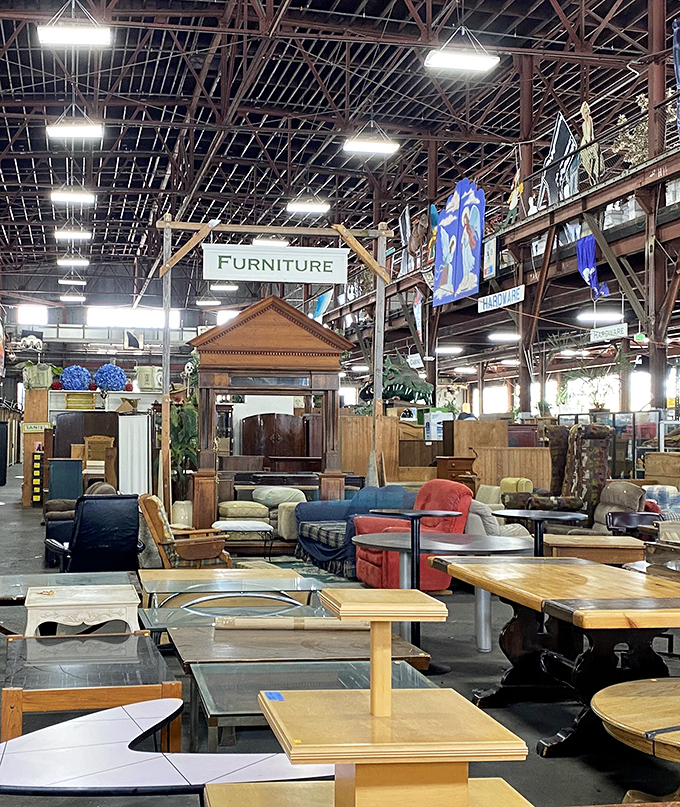 
The furniture section stretches beneath industrial rafters, a showroom where mid-century meets Victorian meets "what exactly is that style?"