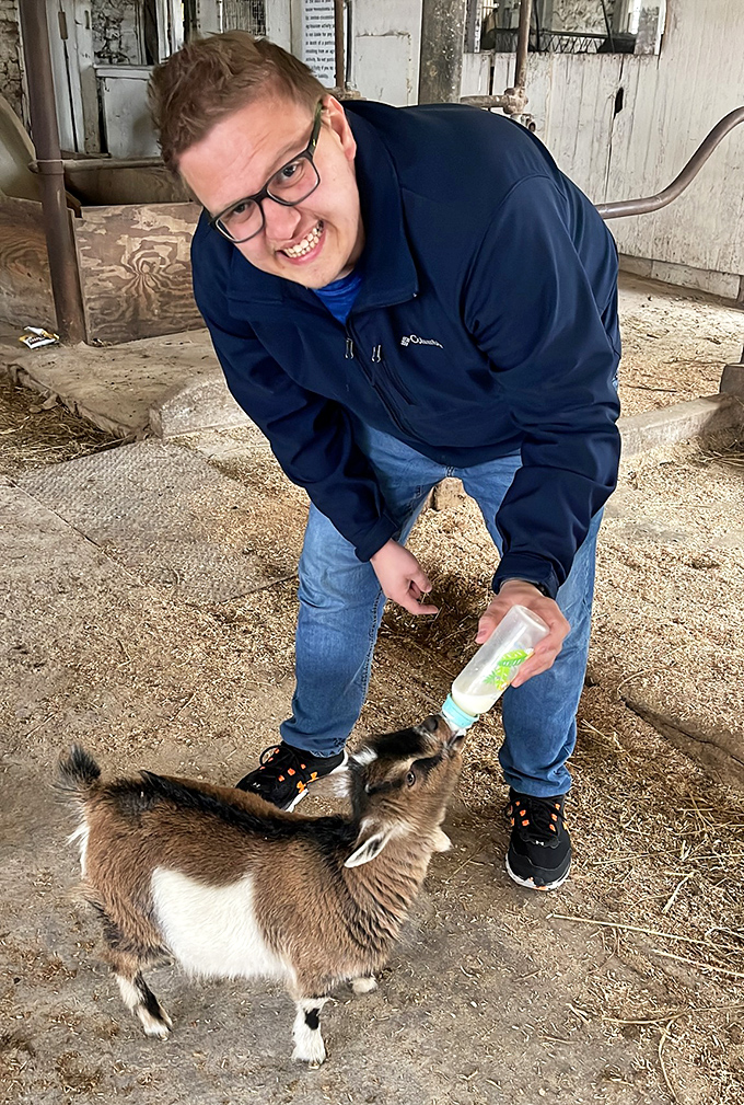 The joy of bottle-feeding a baby goat might be the therapy session you didn't know you needed.