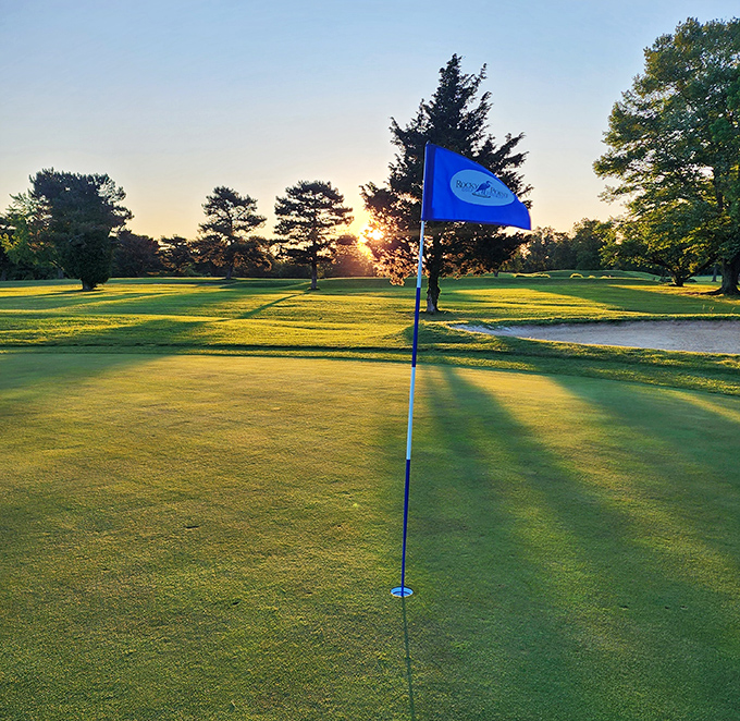 Where golf meets gorgeous. This flag stands sentinel over emerald fairways with water views that distract even the most focused putters.