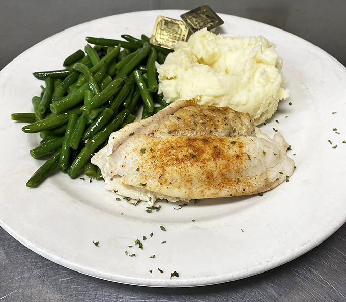 Perfectly grilled fish paired with vibrant green beans and creamy mashed potatoes creates restaurant-quality comfort.