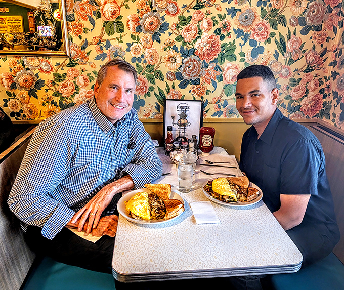 Two happy diners enjoying the kind of breakfast that makes Monday mornings bearable and Sunday mornings worth getting up for.