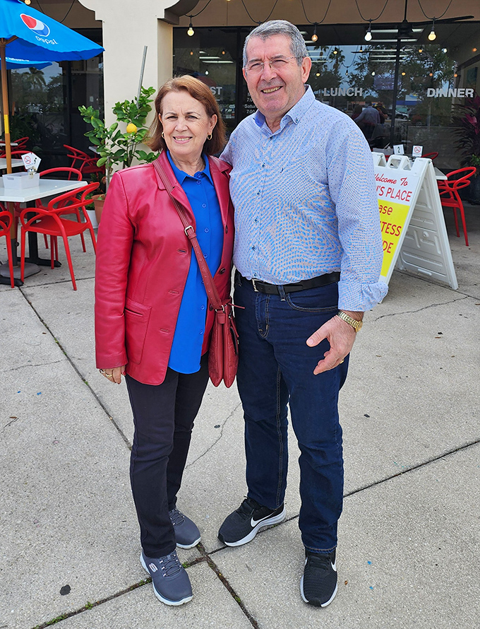Happy diners outside Popi's Place&mdash;living proof that good food creates the kind of smiles no Instagram filter could ever improve upon.