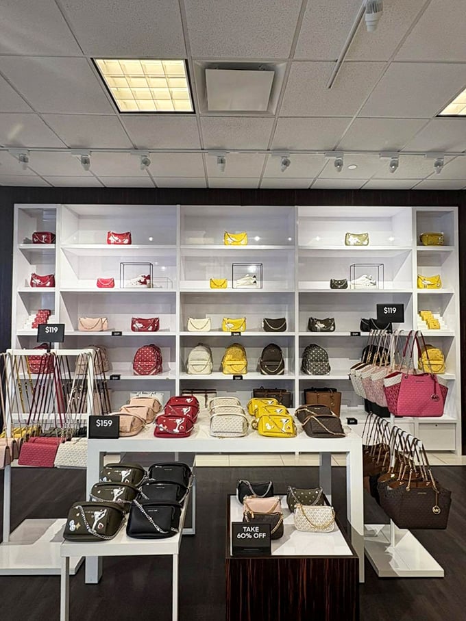Designer handbags arranged with museum-like precision. At these outlet prices, you can finally tell people "Oh this? It's just my Michael Kors."