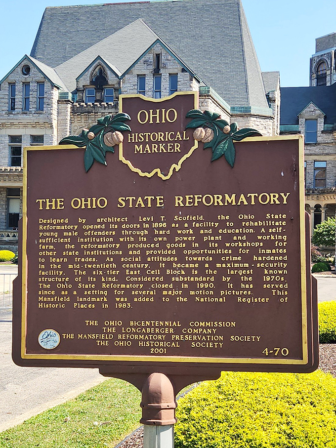 History condensed to a bronze plaque. The official marker sanitizes decades of complex stories that echo through the reformatory's halls.