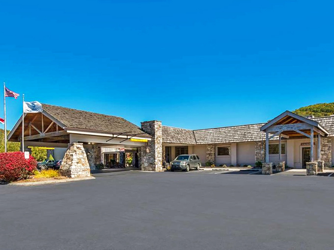 This mountain lodge entrance says "welcome" with stone pillars and timber beams&mdash;architecture that speaks the universal language of "come in and relax."