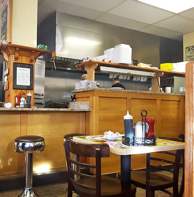 A glimpse into the engine room where breakfast dreams are manufactured with military precision and grandmotherly love.