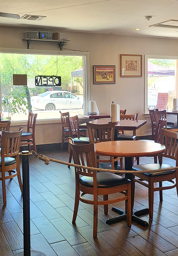 Sunlight streams through windows into the dining room, illuminating simple artwork that hints at the cultural heritage behind each dish.