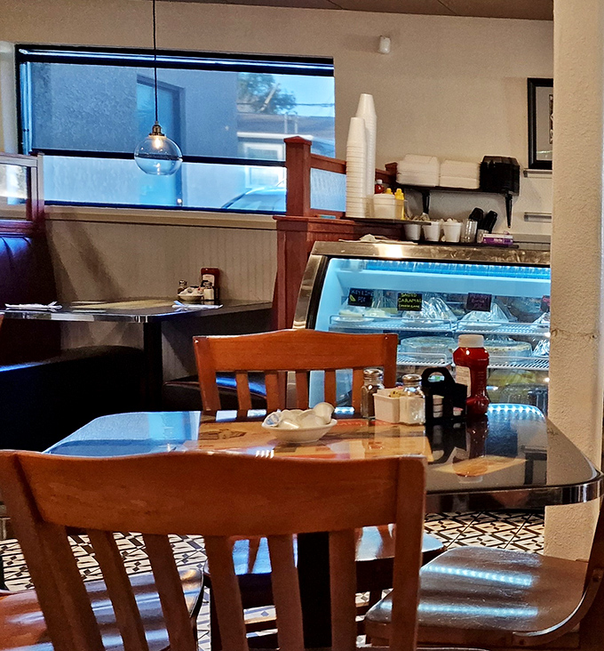 A glimpse into the dessert case promises sweet endings to hearty meals. Those wooden chairs have supported thousands of happy diners.