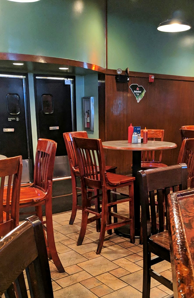 High-top tables and warm wood tones create the perfect perch for people-watching while debating whether to order seconds or save room for dessert.