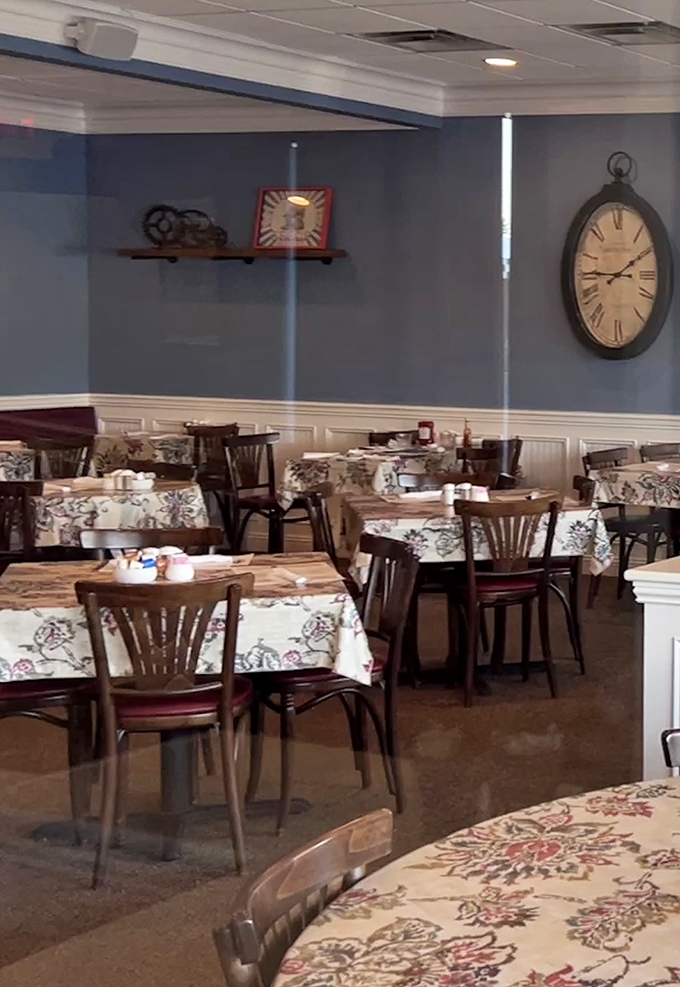 Vintage clocks remind you that time slows down when breakfast is this good. The floral tablecloths add that touch of homey charm.