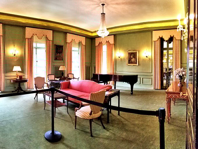 Step into Kingwood Hall's elegant interior, where mint green walls, coral accents, and period furnishings transport visitors to a more gracious era.