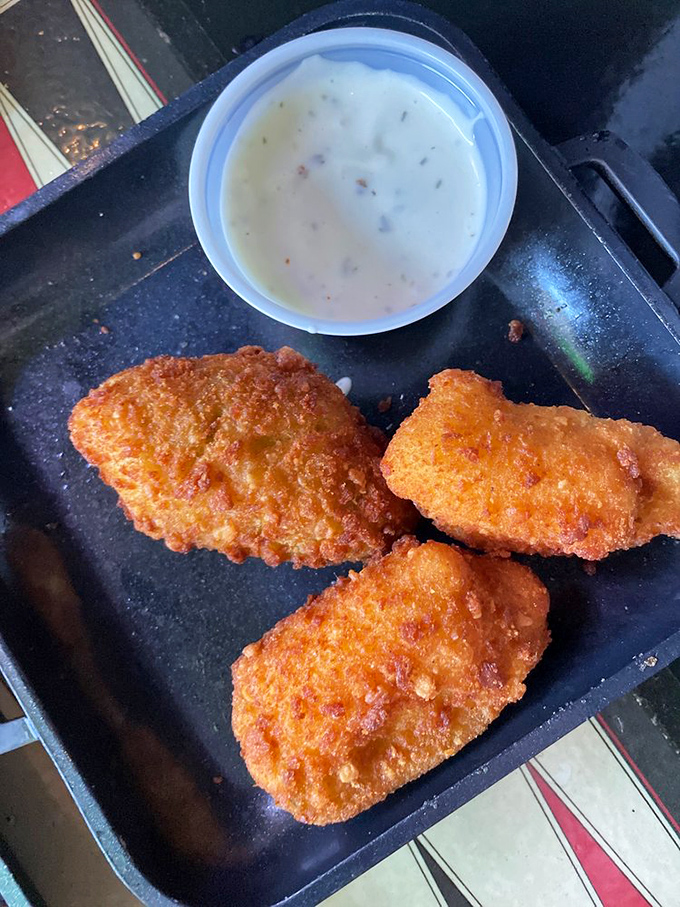 These aren't just any jalapeño poppers – they're golden-fried flavor bombs waiting to detonate on your taste buds.