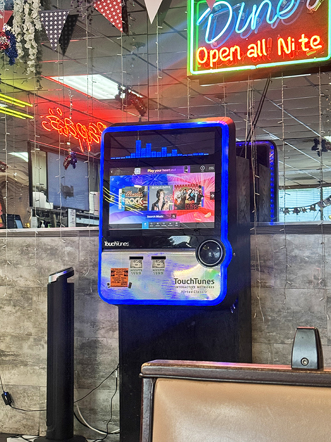 The jukebox – where $1 still buys you three songs and a brief escape to simpler times. Musical time travel with your meal.