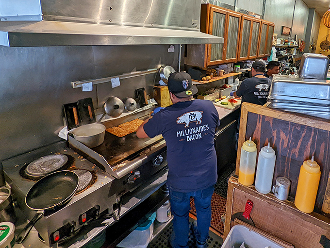Where the magic happens: skilled hands working the grill, turning simple ingredients into memories that linger long after the check arrives.