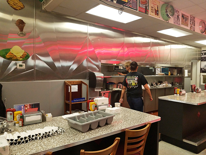 Where the magic happens&mdash;Mels' kitchen gleams with stainless steel efficiency, ready to turn out plate after plate of diner perfection.