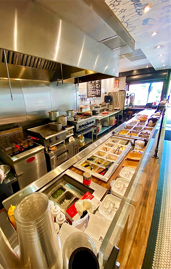 Behind the scenes where the magic happens. That prep station is like a hot dog artist's palette, each ingredient waiting for its moment to shine.