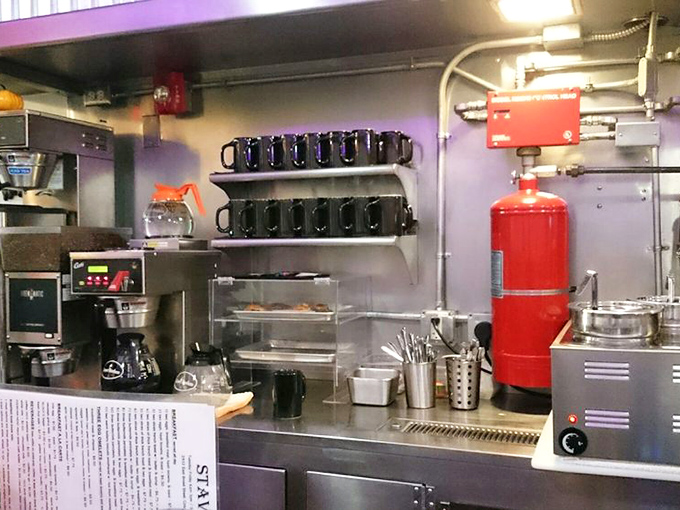 The coffee station&mdash;command central for morning revival. Those blue mugs stand ready for duty like caffeinated soldiers awaiting their marching orders.