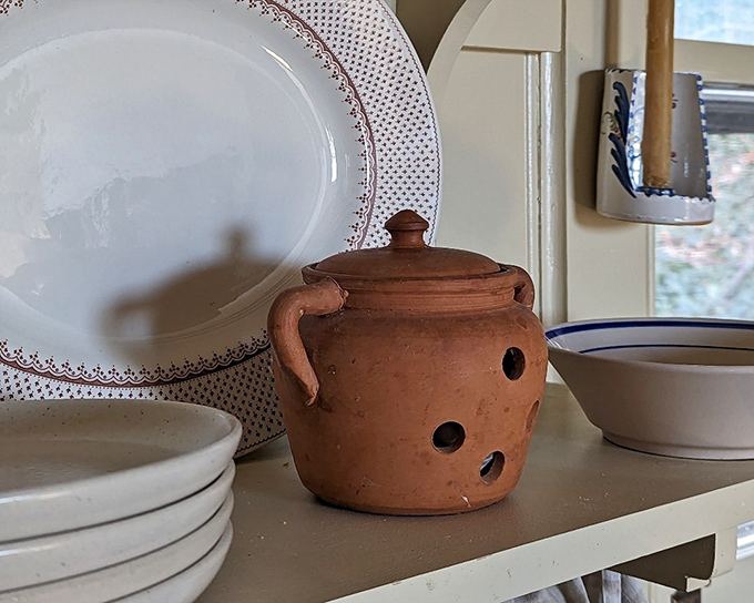 Kitchen treasures that have survived decades of family dinners. That terracotta pot has probably seen more authentic cooking than most Food Network stars.