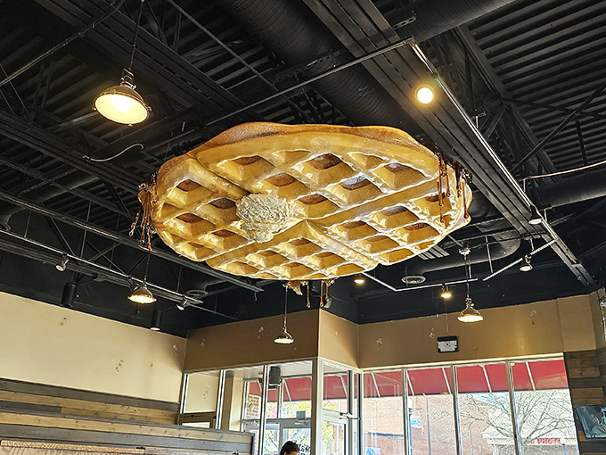 The giant waffle chandelier hanging from the ceiling &ndash; because subtle d&eacute;cor is for restaurants that don't understand commitment.