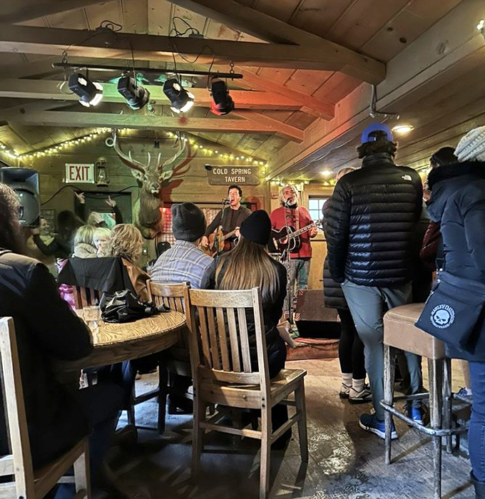 Toe-tapping tradition: Live music transforms this rustic room into a community gathering where strangers become friends over shared rhythms and cold drinks.