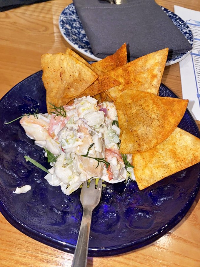 Seafood salad and crispy chips on that signature blue plate&mdash;like ocean treasures washed ashore, but tastier and with less sand.