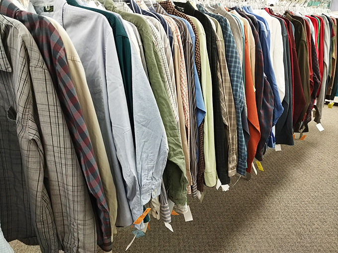 The men's shirt section – a rainbow of possibilities where plaid dreams come true and business casual meets budget-friendly.