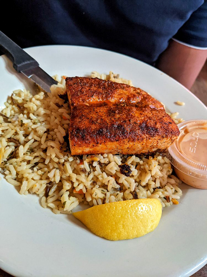 Blackened fish resting on a bed of rice like it's on vacation in the tropics, bringing a taste of coastal living to landlocked Ohio.