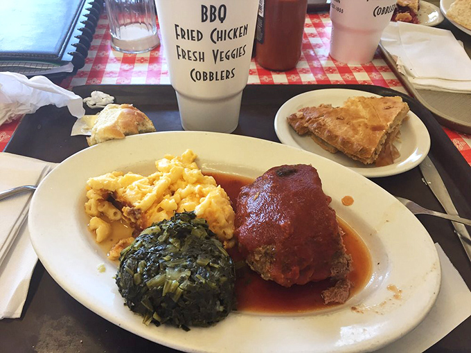 Meatloaf that doesn't apologize for being meatloaf, flanked by mac and cheese that's definitely counting as your vegetable.