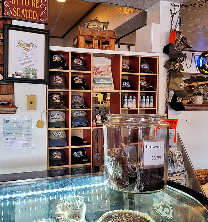 Jack's merchandise wall &ndash; where you can take home a souvenir that says "I survived a breakfast that required hiking gear to finish."