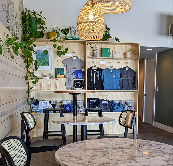 Even the retail corner feels curated and cool, with hanging plants, woven light fixtures, and merchandise that lets you take the vibe home.