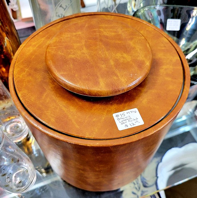 Mid-century ice bucket with leather detailing&mdash;because even in the 1960s, cocktail hour demanded proper accessories.