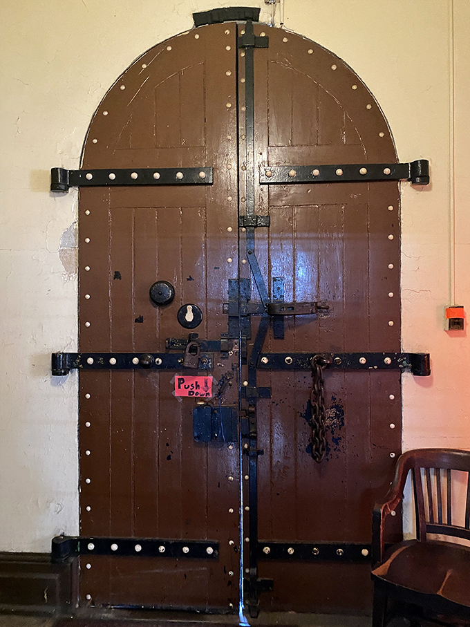 This formidable wooden door, reinforced with iron bands and studded for extra security, wasn't meant to welcome guests with open arms.