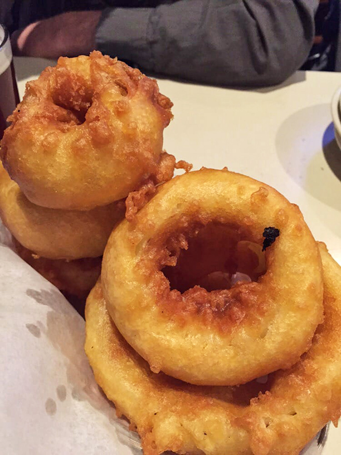Golden-brown onion rings with a batter so crisp you'll hear them crunch from across the room, served with a dipping sauce worth fighting over.