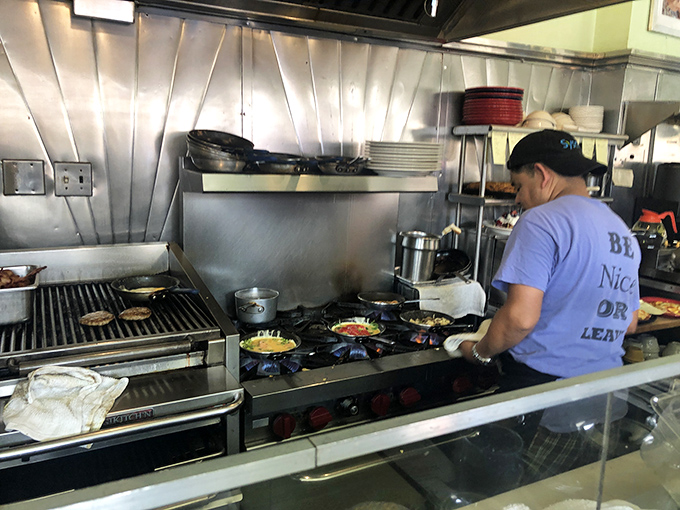 Behind every great breakfast is a focused chef, orchestrating eggs, meats, and potatoes into symphonies of morning deliciousness.