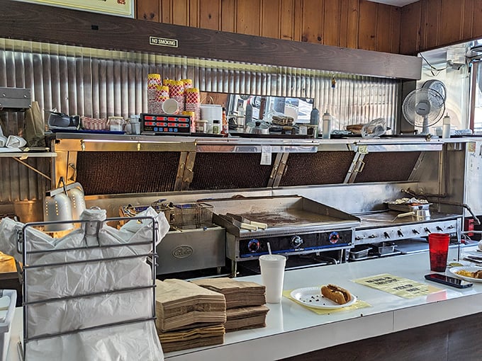 An open kitchen where the magic happens without pretense. No foam, no tweezers, just skilled hands creating comfort on a plate.