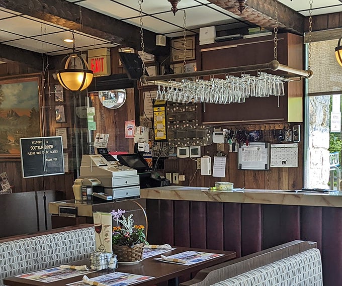 Behind this counter, breakfast dreams come true. The red-checkered wall adds that perfect touch of nostalgic charm.