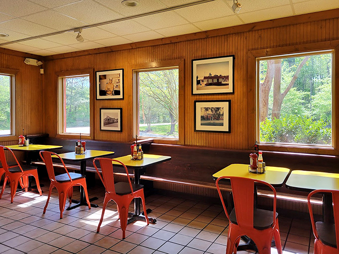 Wood paneling and large windows create a dining room that feels like a comfortable cabin dedicated to barbecue appreciation.
