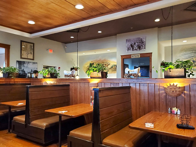 Warm wood tones and thoughtful dividers create intimate dining spaces where conversations flow as freely as the sweet tea.